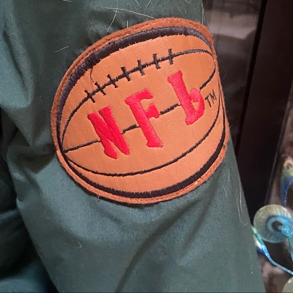 Weird "alternate" NFL league logos on a line of 1990s coats - Sports ...
